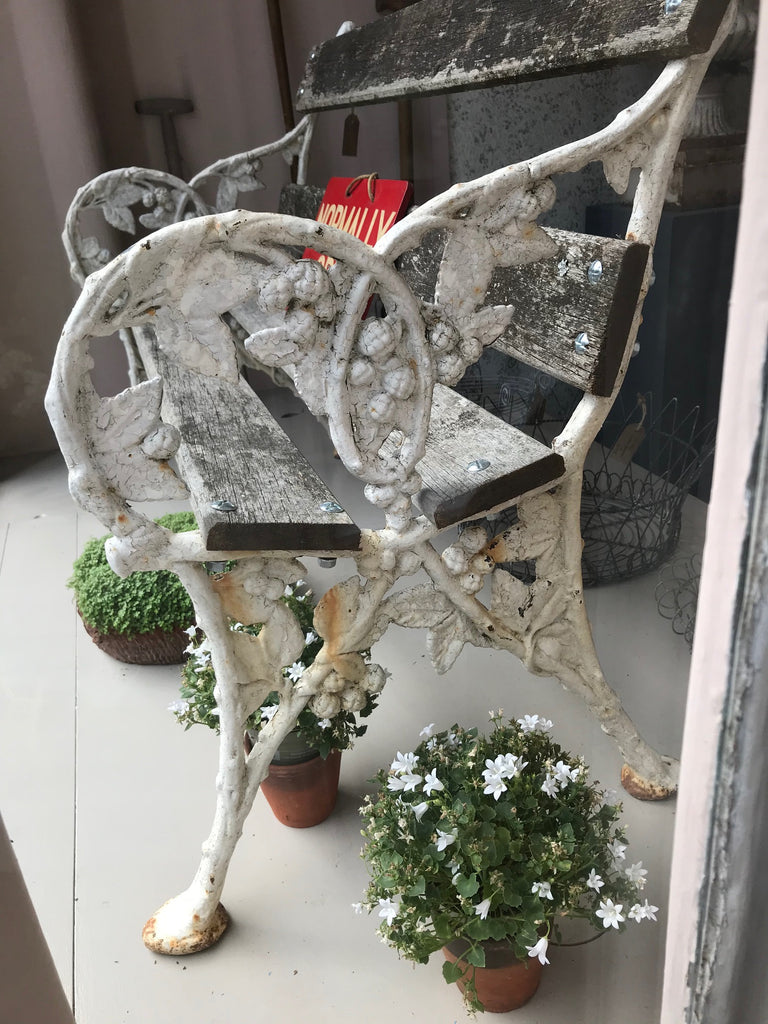 A cast iron garden bench from the Falkirk Foundry with the ends in the ...